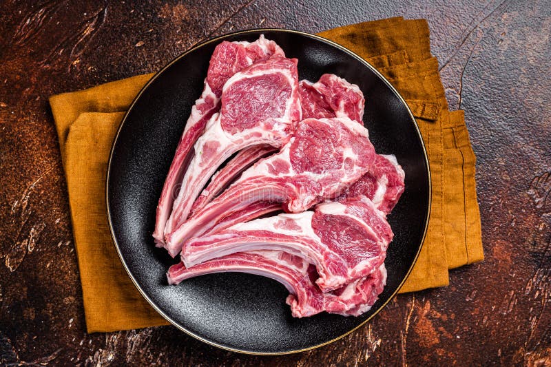 Raw Lamb Chops, Fresh Mutton Meat Cutlets on a Ribs. Dark Background ...