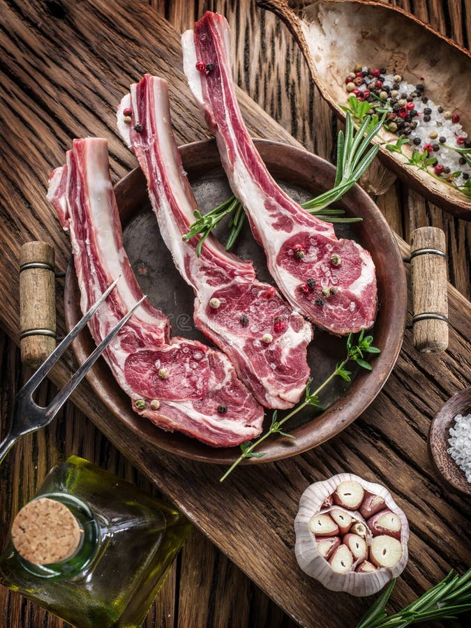 Raw Lamb Chops with Garlic and Herbs. Stock Photo - Image of olive ...