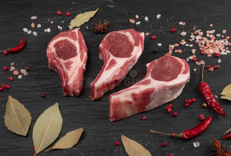 Raw Lamb Chops, Mutton Cuts or Sheep Ribs on Black Stock Image - Image ...