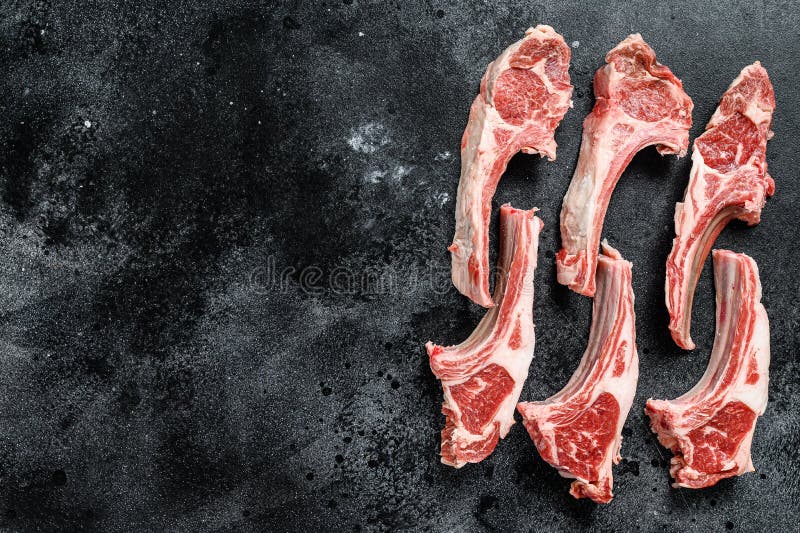 Raw Lamb Chops, Rack of Lamb. Black Background. Top View Stock Photo ...