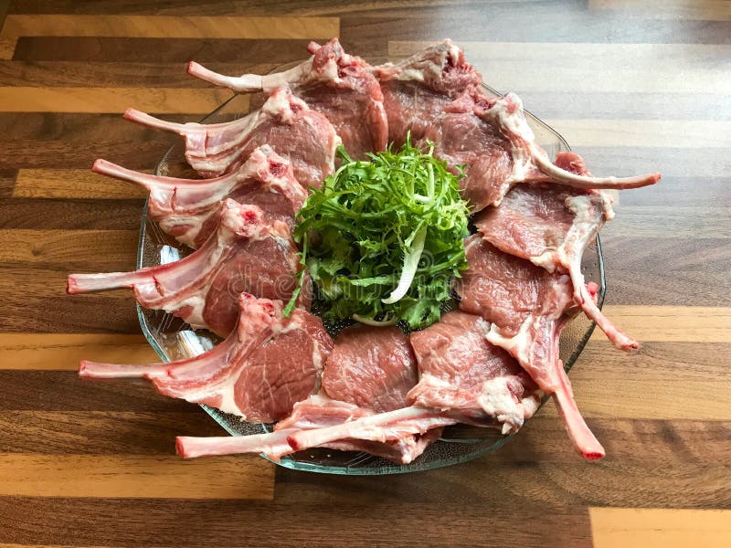 Raw Lamb Chops in Round Plate with Greens Ready To Cook Stock Photo ...