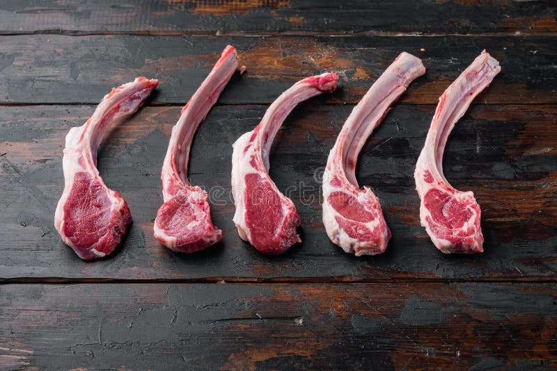 Raw Lamb Filets on Bone, on Old Dark Wooden Table Background, Top View ...