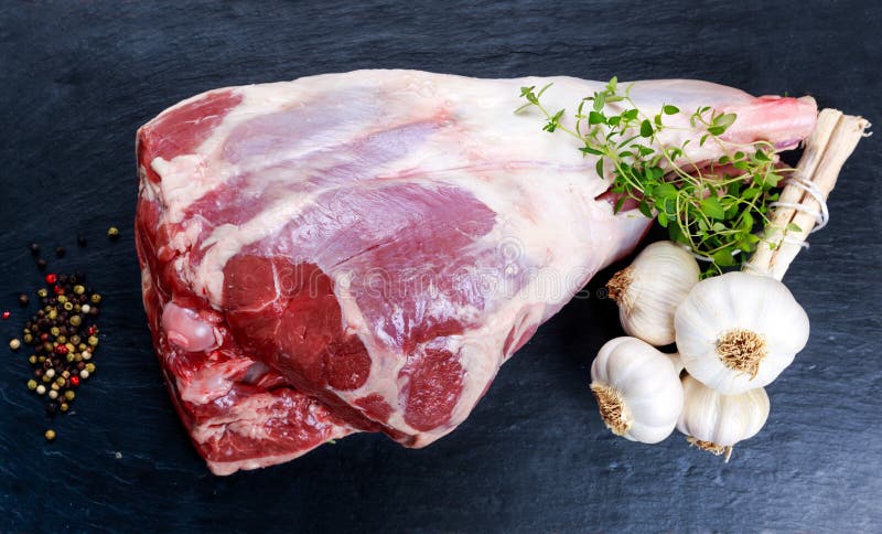 Raw Lamb Leg on Blue Stone Background with Herbs Stock Image - Image of ...