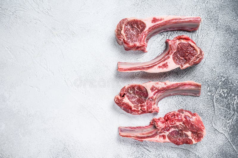 Raw Lamb Meat Chops on a Butcher Table. White Background. Top View ...