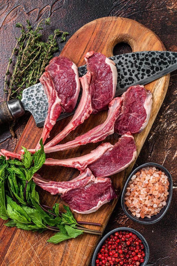 Raw Lamb, Mutton Chops Steaks on a Wooden Board. Dark Background Stock ...