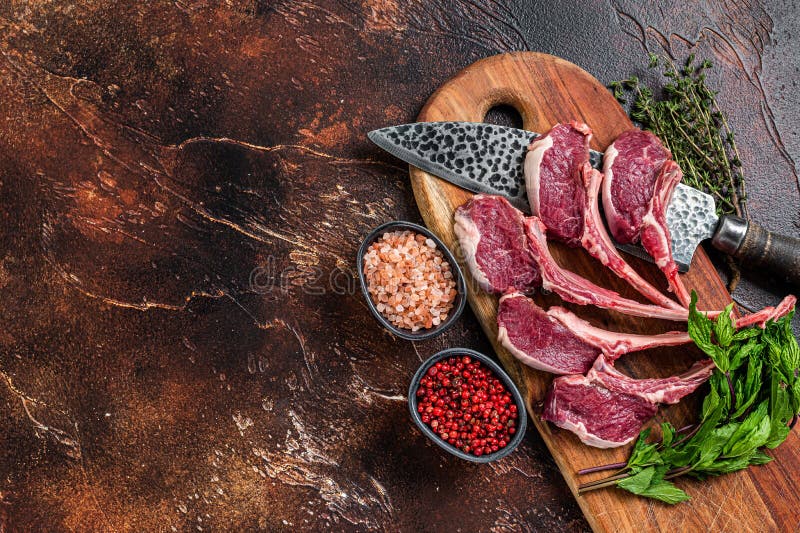 Raw Lamb, Mutton Chops Steaks on a Wooden Board. Dark Background. Top ...