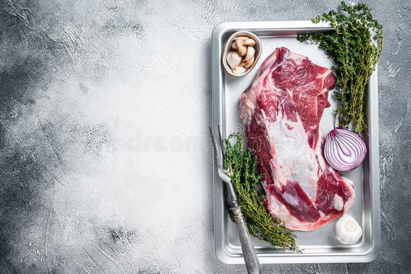 Raw Lamb Mutton Shoulder Meat in a Baking Dish with Thyme and Garlic ...