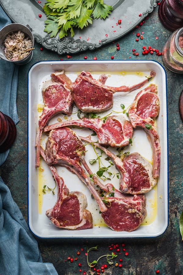 Raw Lamb Ribs, Marinating of Lamb Racks on Rustic Kitchen Table Stock ...