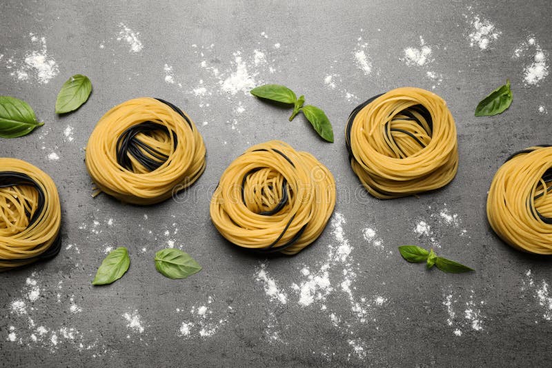 Raw Linguine Pasta with Basil on Grey Table Stock Image - Image of ...