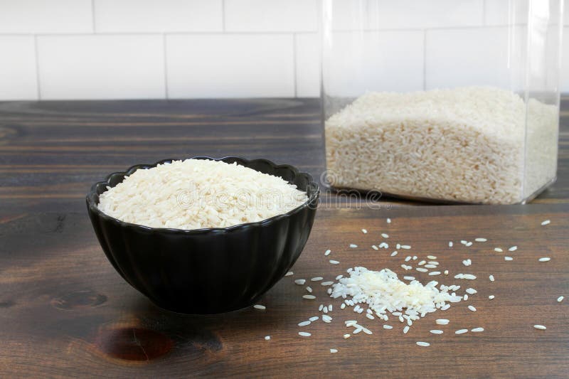 Raw Long Grain White Rice in Bowl Stock Photo - Image of white, macro ...