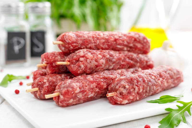 Raw lula kebab on skewers stock photo. Image of beef - 146395296