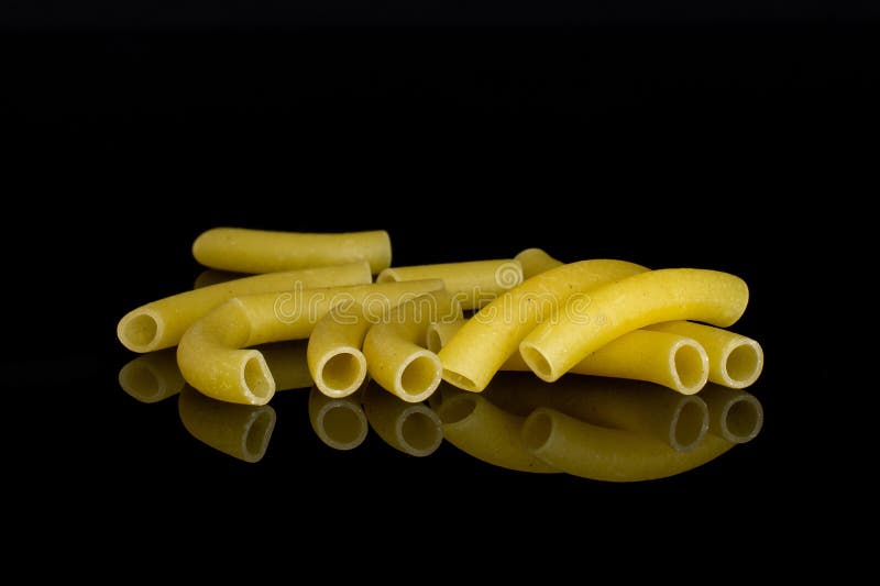 Raw Macaroni Pasta Isolated on Black Glass Stock Image - Image of ...