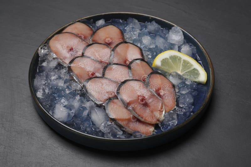 Raw Mackerel Slices, Ice Cubes and Lemon on Grey Table. Fish Delicacy ...