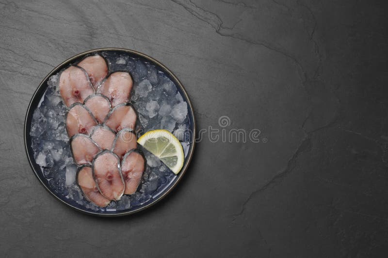 Raw Mackerel Slices, Ice Cubes and Lemon on Grey Table, Top View with ...