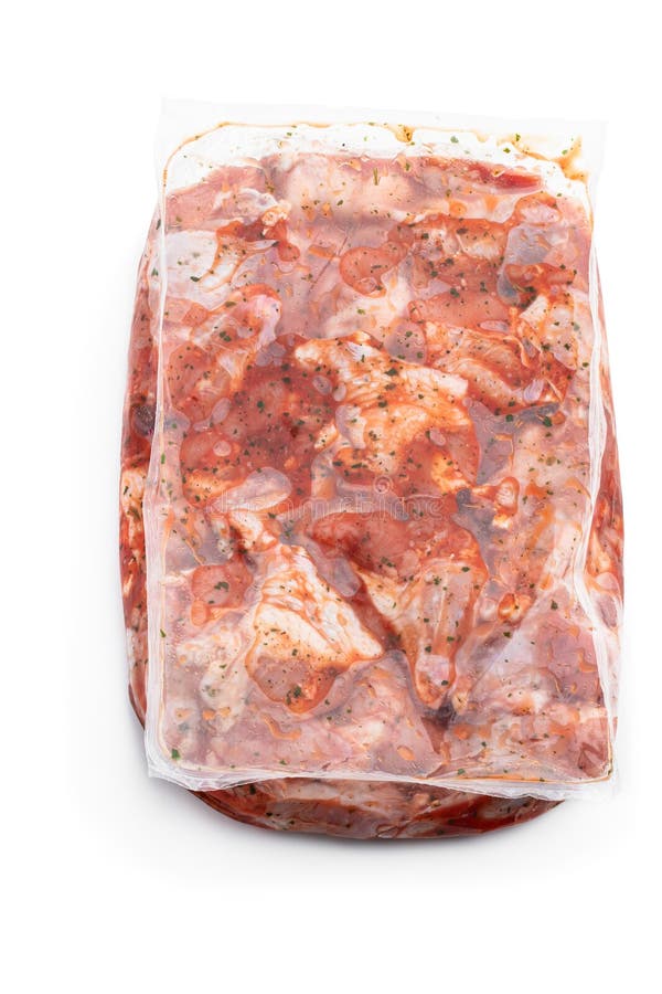 Raw Marinated Chicken Meat in Vacuum Packaging on a White Background ...
