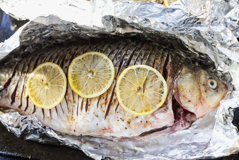 Raw Marinated Fish with Spices and Lemons Ready for Roasting Stock ...