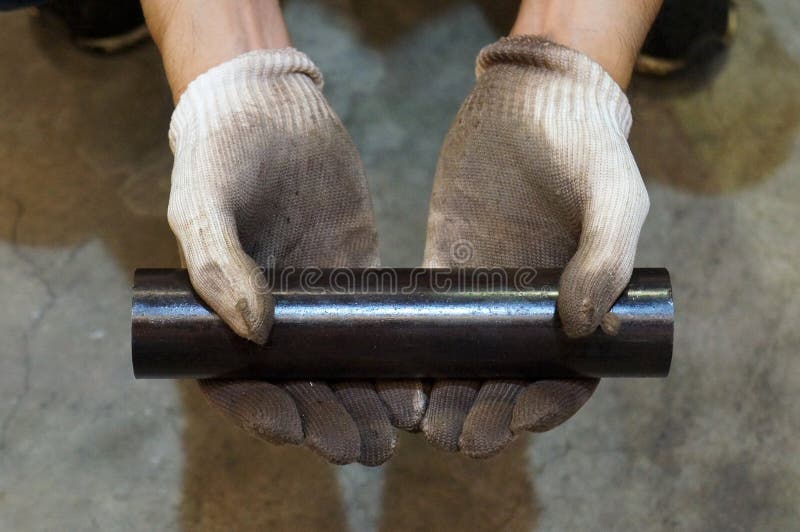Raw Material Rod on Hand a Man in Factory. Stock Photo - Image of shape ...
