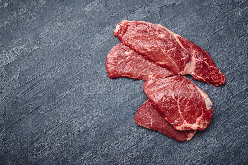 Raw Meat Beef Steak on Black Top View Stock Photo - Image of salt ...