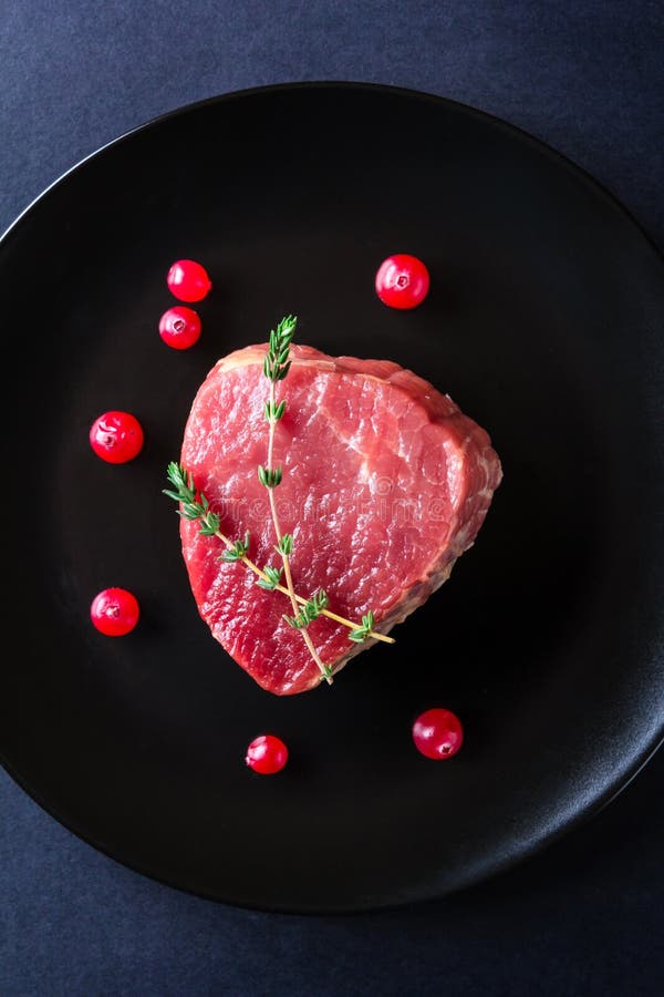 Raw Meat on Black Plate and Red Towel. Clasic Still Life Stock Photo ...