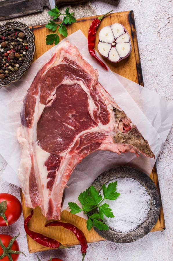 Raw meat with bones stock image. Image of paper, preparation - 124858645