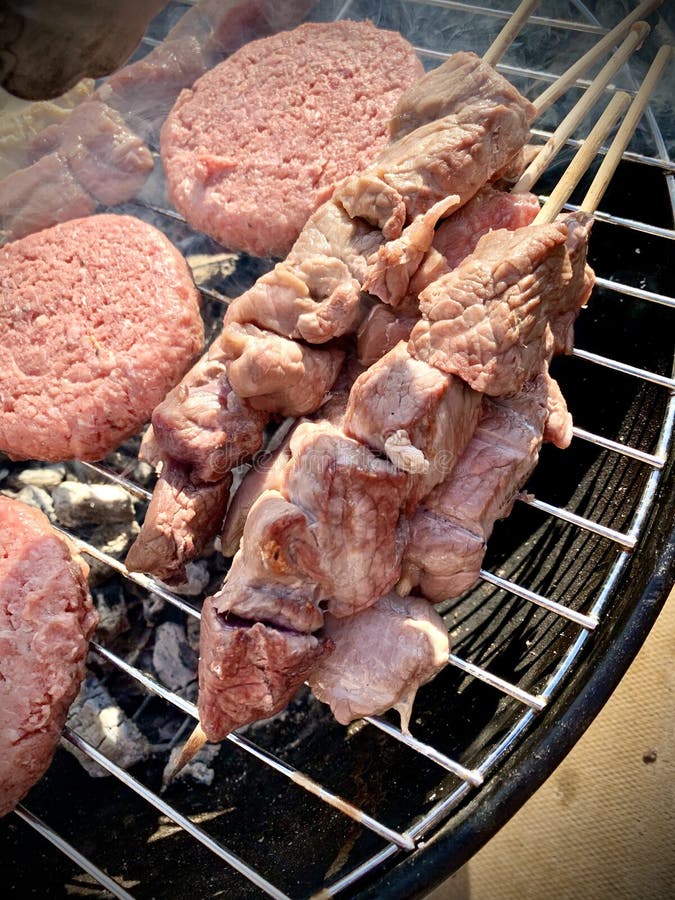 Raw Meat Cooking Over a Bbq Stock Photo - Image of coals, burger: 182264014