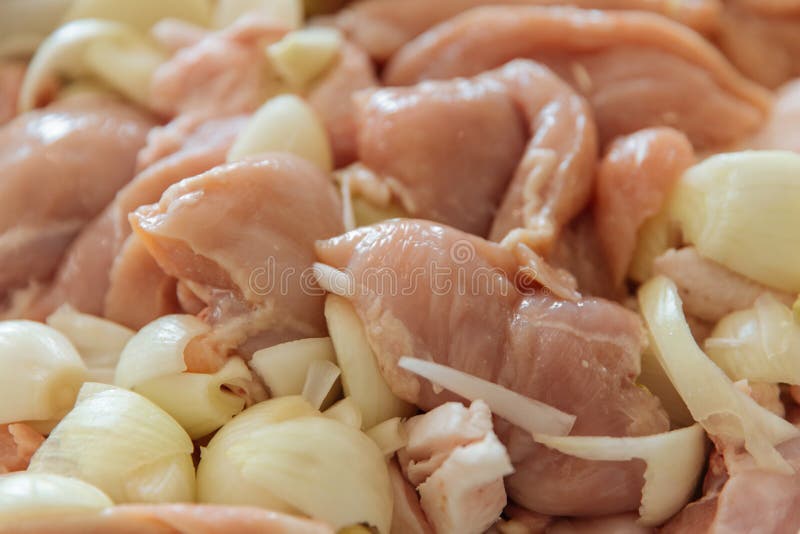 Raw Meat Cut into Pieces and Onions.Close Up Stock Photo - Image of ...