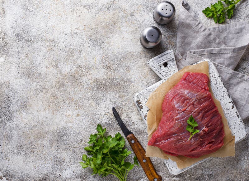 Raw meat on cutting board stock photo. Image of preparation - 146236290