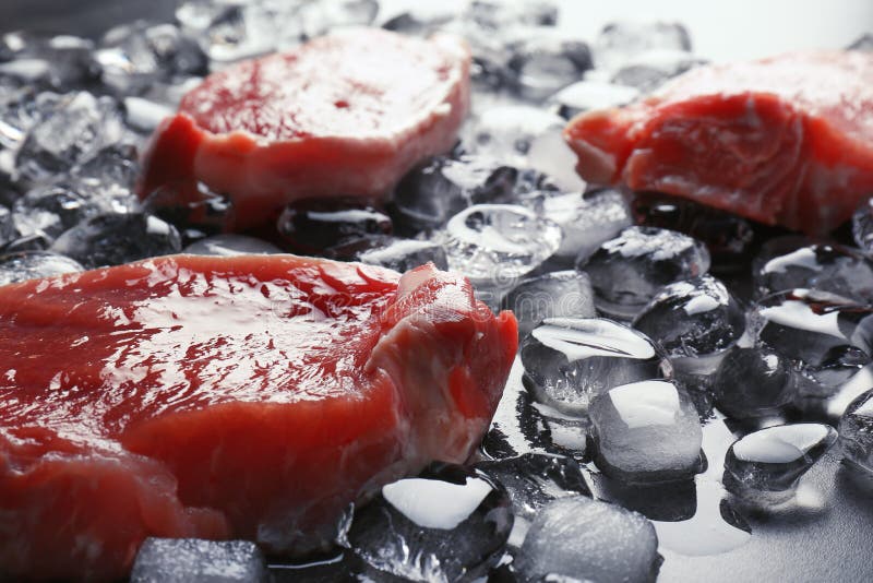 Raw meat and ice cubes stock photo. Image of natural - 140134100