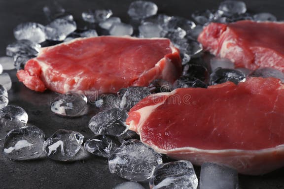 Raw meat and ice cubes stock image. Image of natural - 141305893