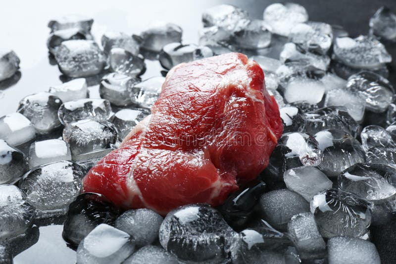 Raw meat and ice cubes stock image. Image of natural - 141305893