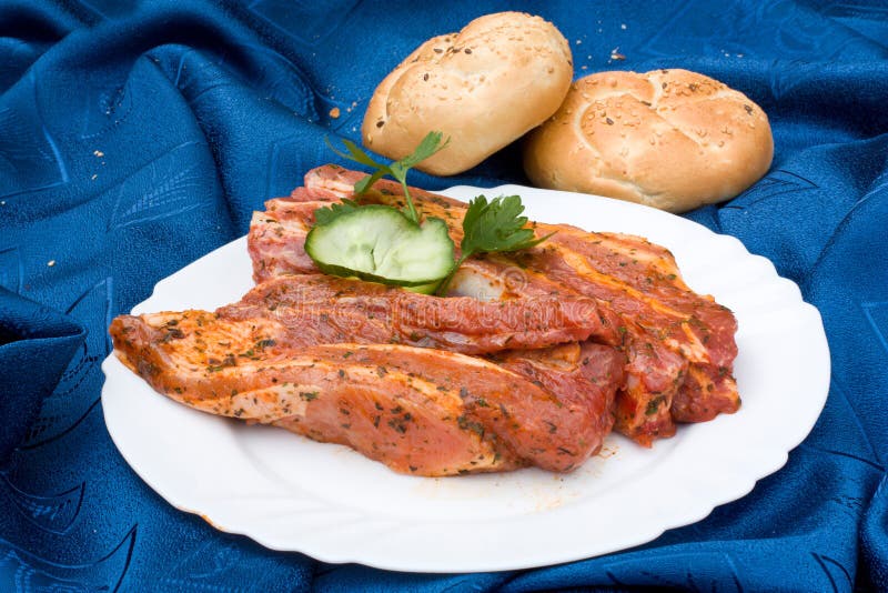 Raw Meat with Loafs of Bread Stock Photo - Image of roast, bread: 12739542