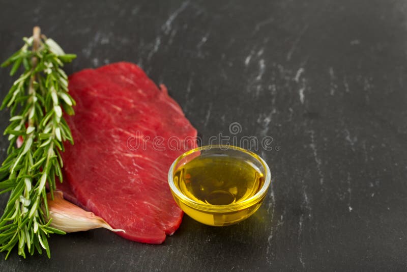 Raw meat with oil stock photo. Image of green, border - 48597568