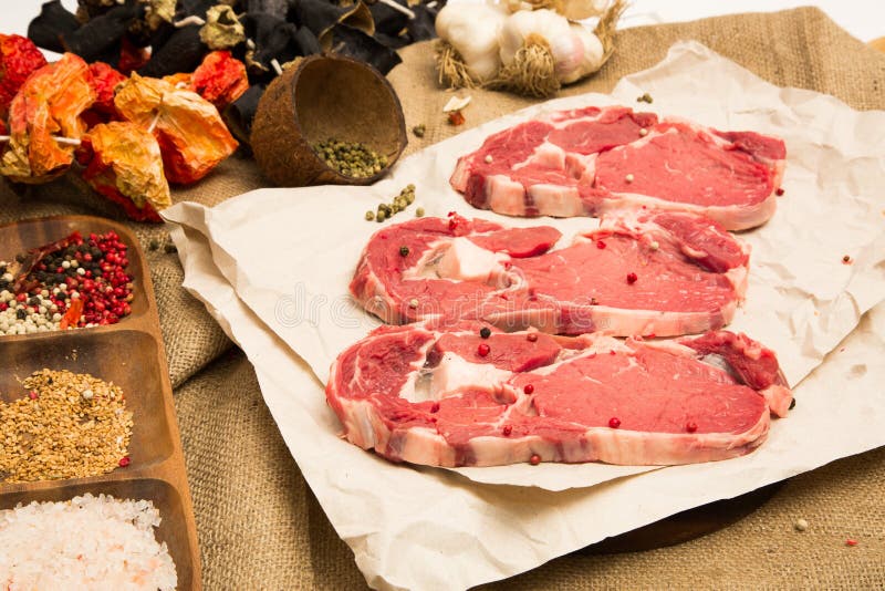 Raw meat on the paper stock image. Image of black, east - 175909105