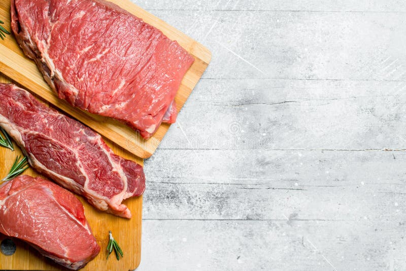 Raw Meat. Pieces of Beef on Cutting Boards Stock Photo - Image of aged ...