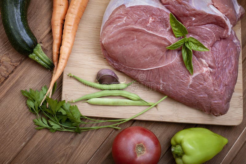 Raw Meat and Vegetables on a Cutting Board Stock Photo - Image of ...