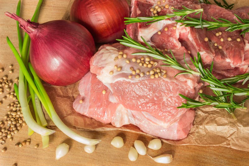 Raw Meat with Vegetables and Greens on a Wooden Table Surface. Stock ...