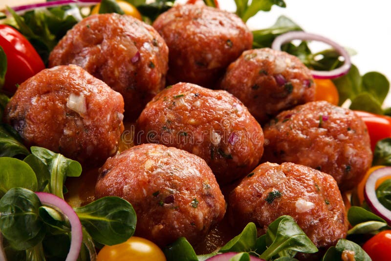 Raw Meatballs on Cutting Board on White Background Stock Photo - Image ...
