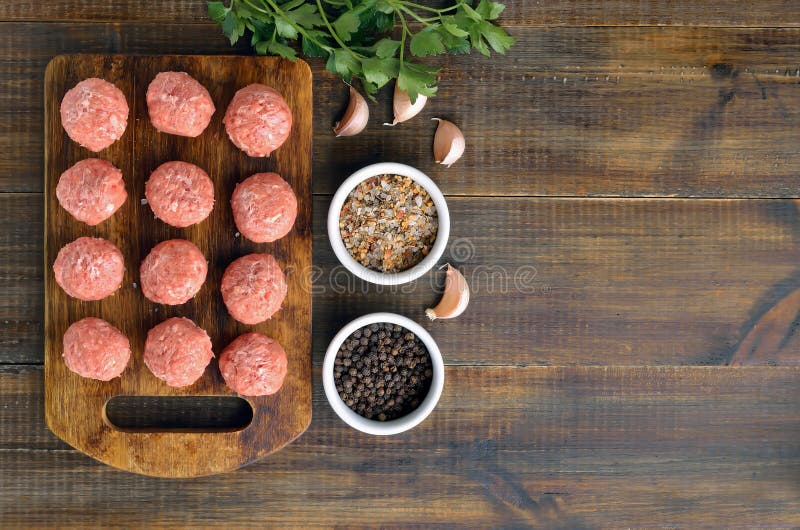 Raw Meatballs on the Cutting Board Stock Photo - Image of close, green ...
