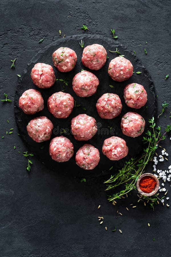 Raw Meatballs on Dark Background Stock Photo - Image of gourmet ...