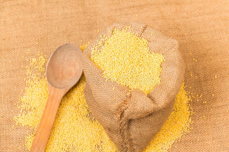 Raw millet stock image. Image of wooden, hulled, spoon - 53472583