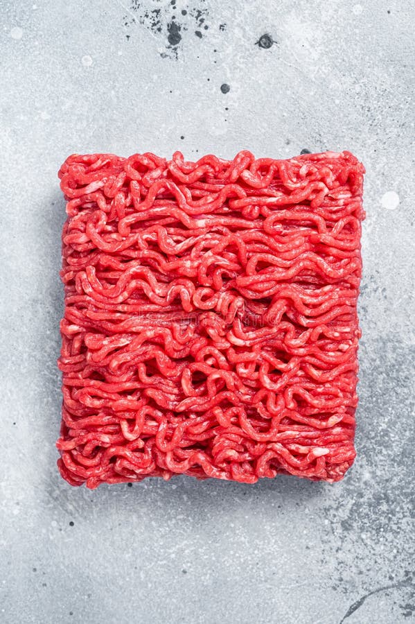 Raw Mince Ground Meat on a Butcher Table. Gray Background Stock Photo ...