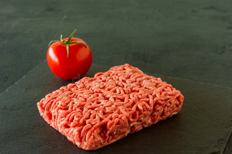 Raw Minced Beef Meat on a Slate with Tomato Stock Image - Image of ... Raw Minced Beef Meat on a Slate with Tomato Stock Image - Image of ...
