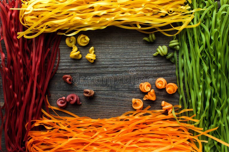 Raw and multicolored pasta stock photo. Image of heap - 98123040