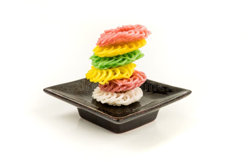 Raw Multicolored Tapioca Crackers Stacked on a Ceramic Plate Angled ...