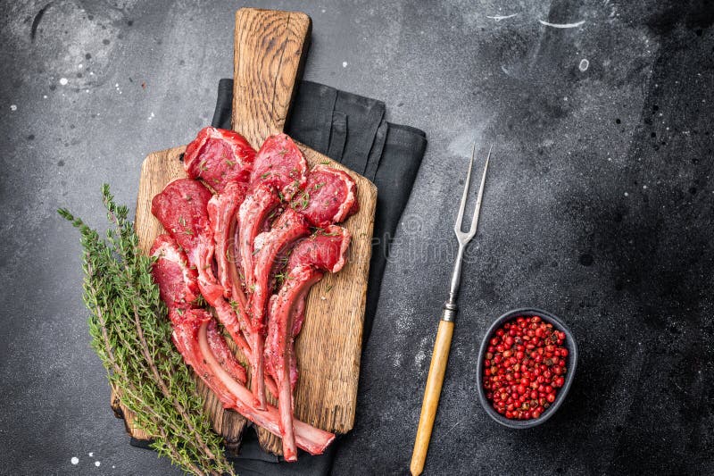 Raw Mutton Cutlets, Fresh Lamb Meat Chops on a Wooden Board. Black ...