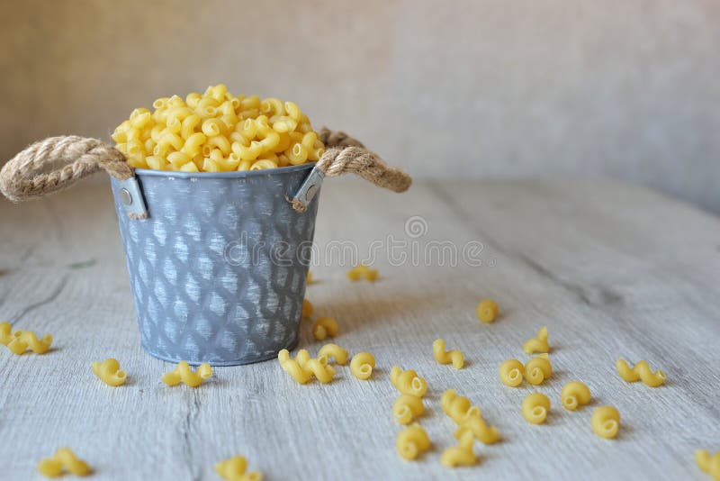 Raw Noodles Pasta Rolls in a Decorative Bucket on the Kitchen Table ...