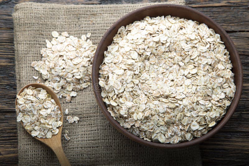 Raw oatmeal in a plate stock image. Image of food, grain - 164835565