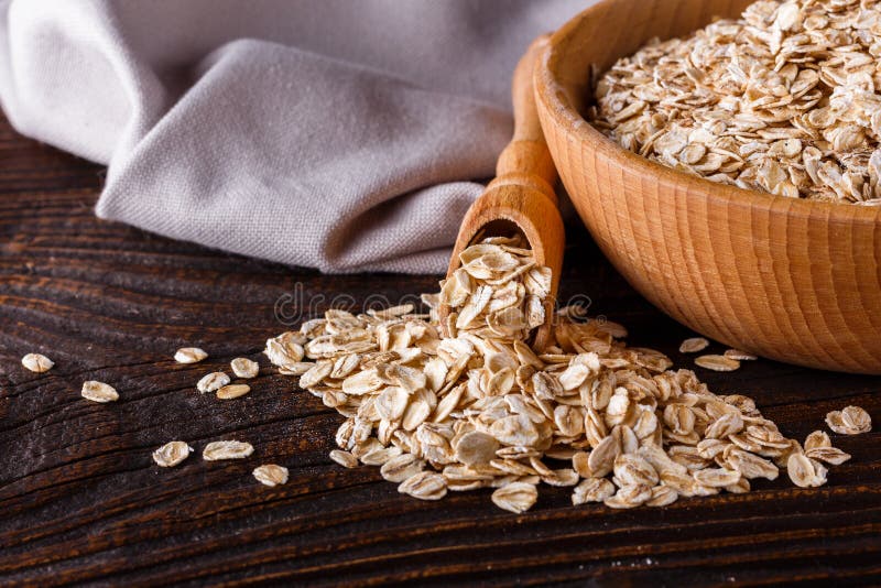 Raw Oatmeal on a Wooden Rustic Background Stock Image - Image of pile ...