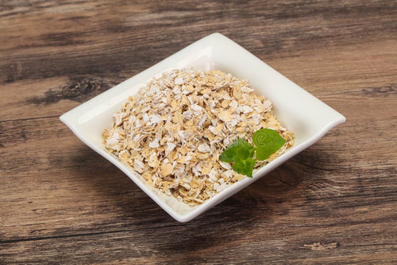 Raw oats in the bowl stock photo. Image of porridge - 177736518