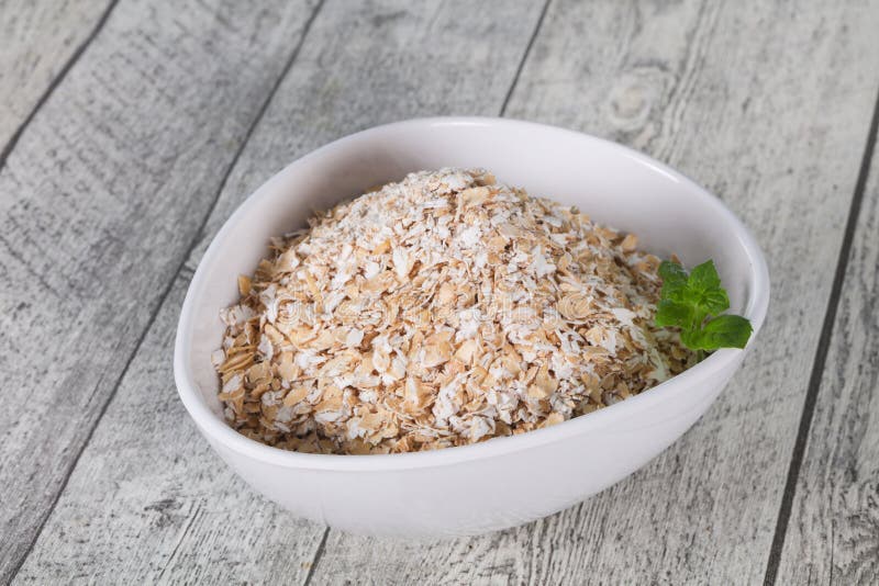 Raw oats in the bowl stock image. Image of vegetarian - 184233337